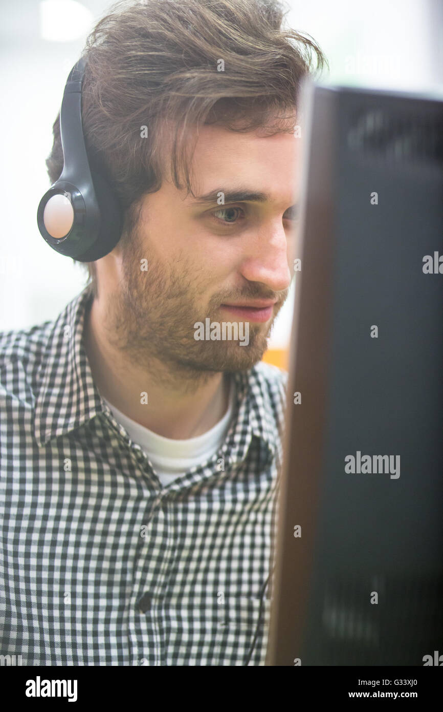 Friendly telephone operator smiling during a telephone conversation ...