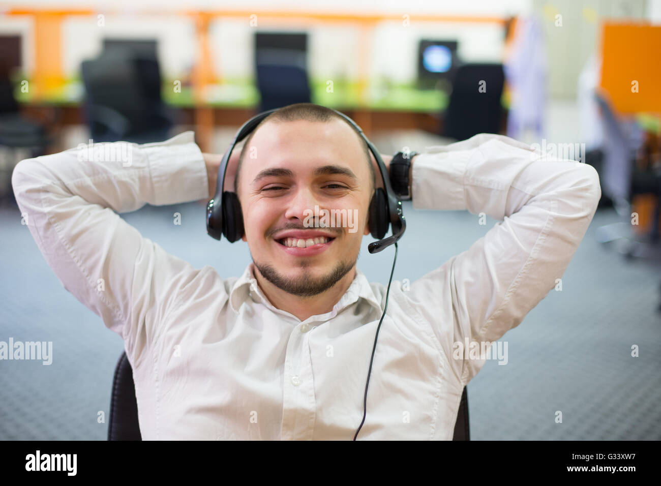Friendly Service Agent Talking To Customer In Call Centre Stock Photo ...