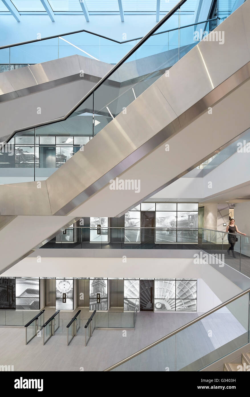 Stairways crossing full-height atrium. KPMG Offices, Leeds, Leeds ...