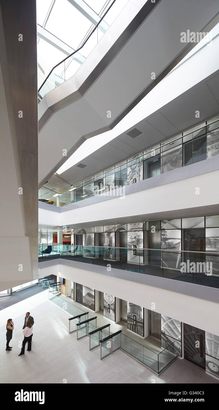 Ground floor reception and atrium with crossing stairway. KPMG Offices ...