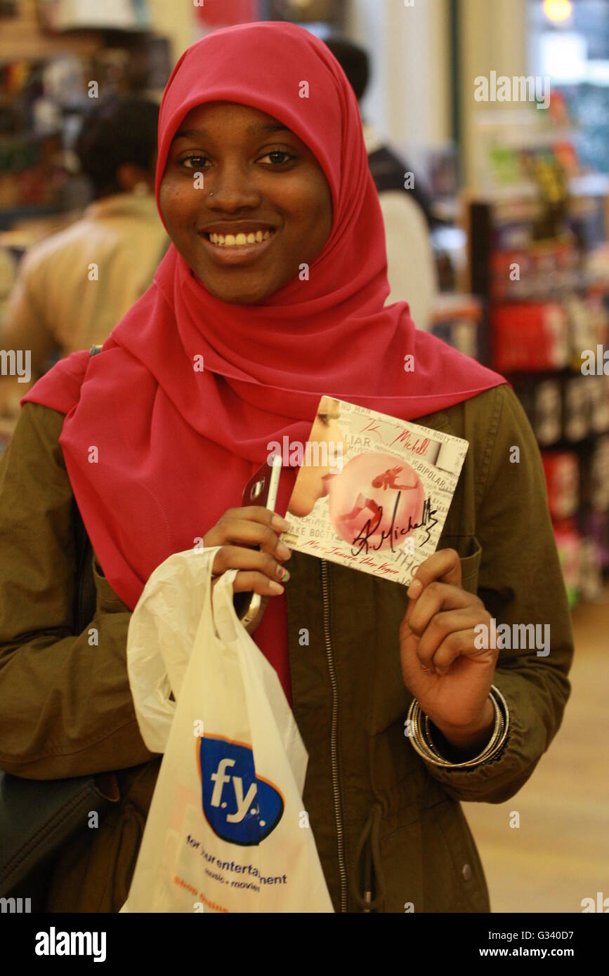Rapper K. Michelle signs copies of her CD at f.y.e store in ...