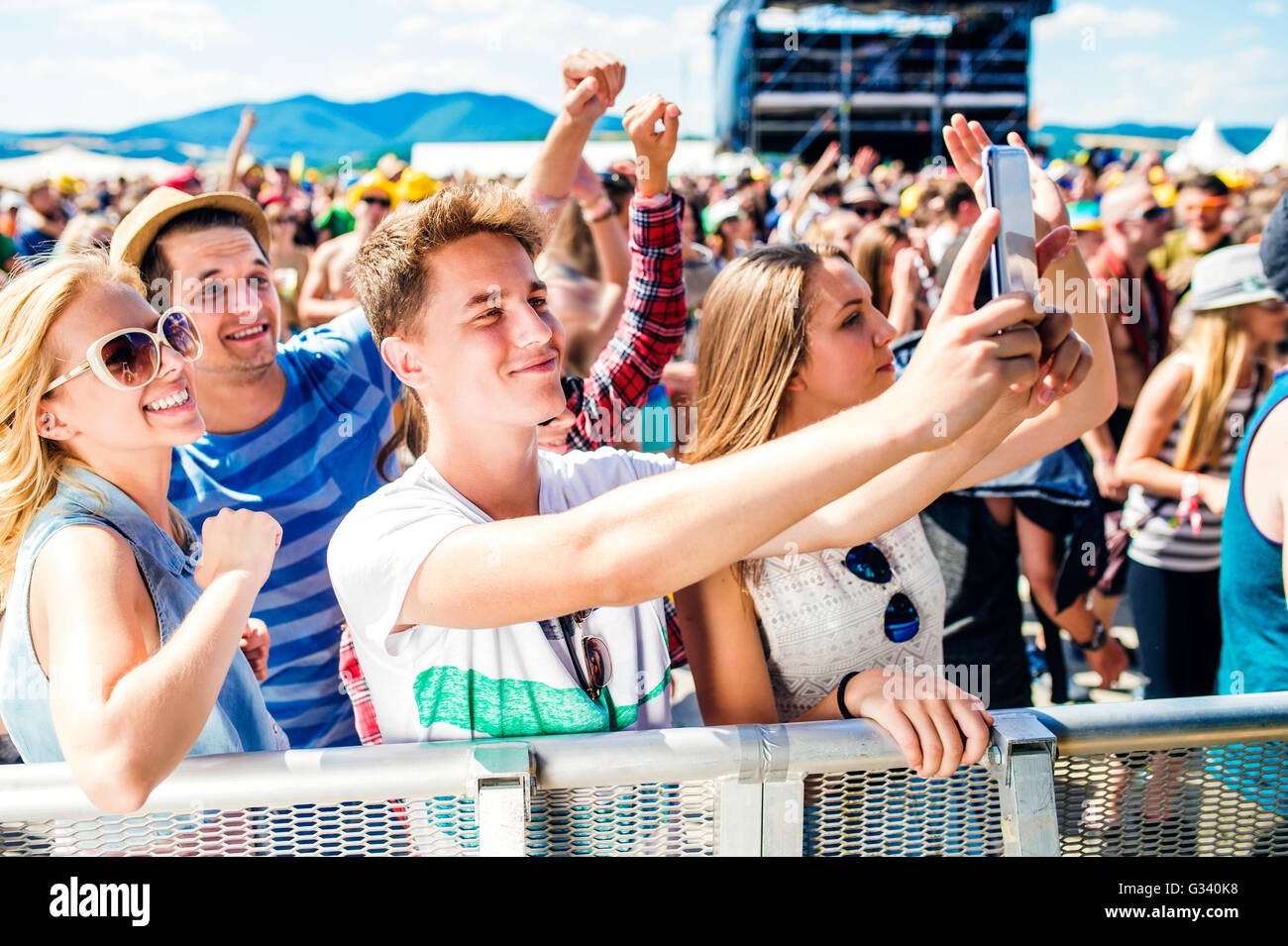 Girl in crowd enjoying music hi-res stock photography and images - Alamy