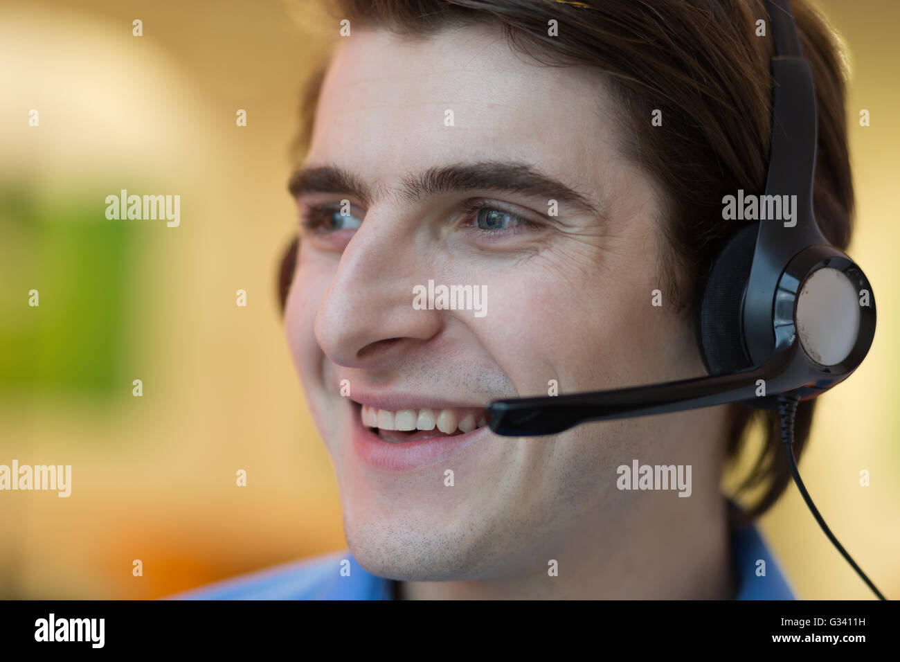 Young call center agent speaking with costumer Stock Photo - Alamy