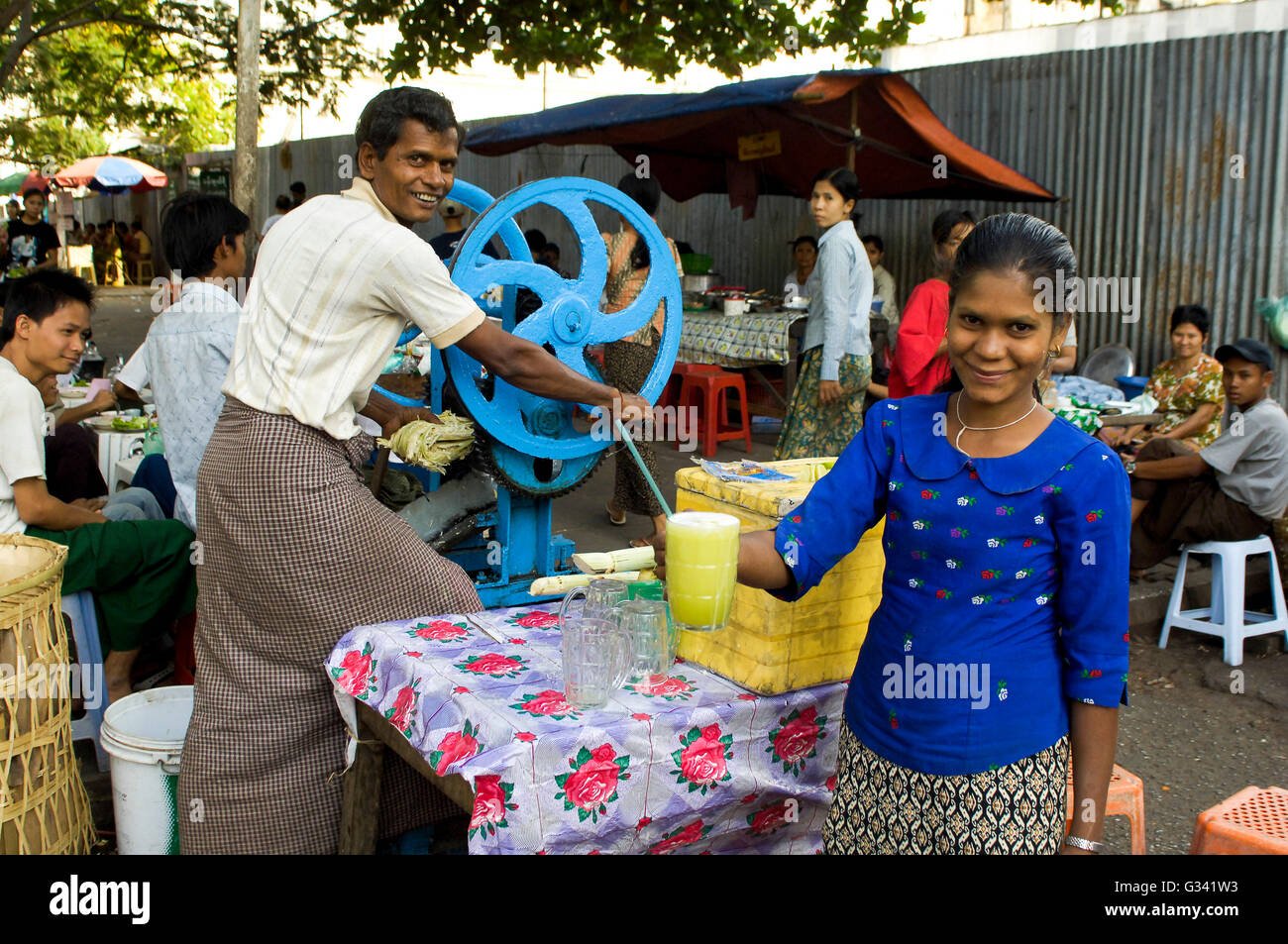 Man Pressing Sugar Cane - Street Scene in Yangon, Myanmar (Rangoon ...