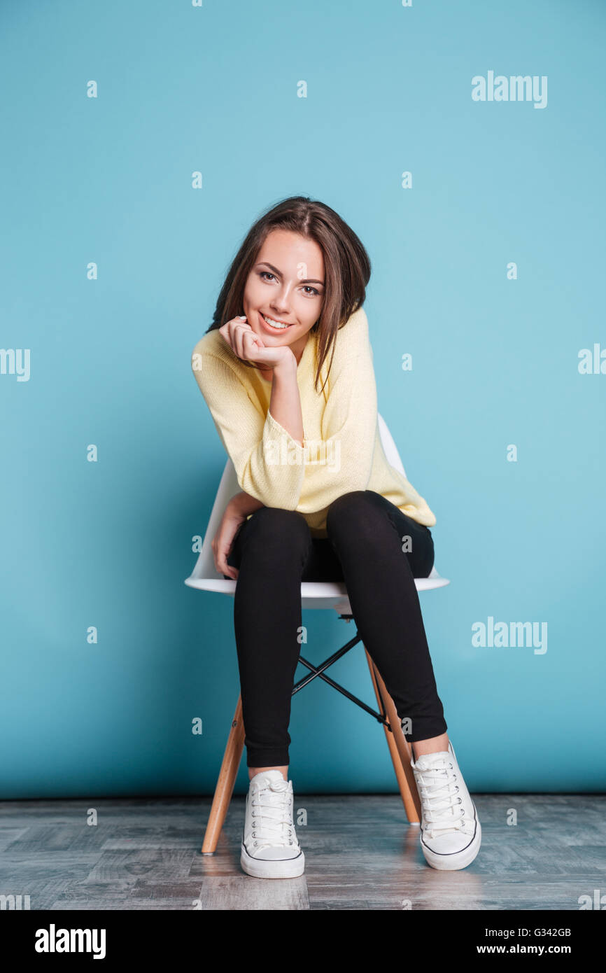 Young woman hand under chin hi-res stock photography and images - Alamy