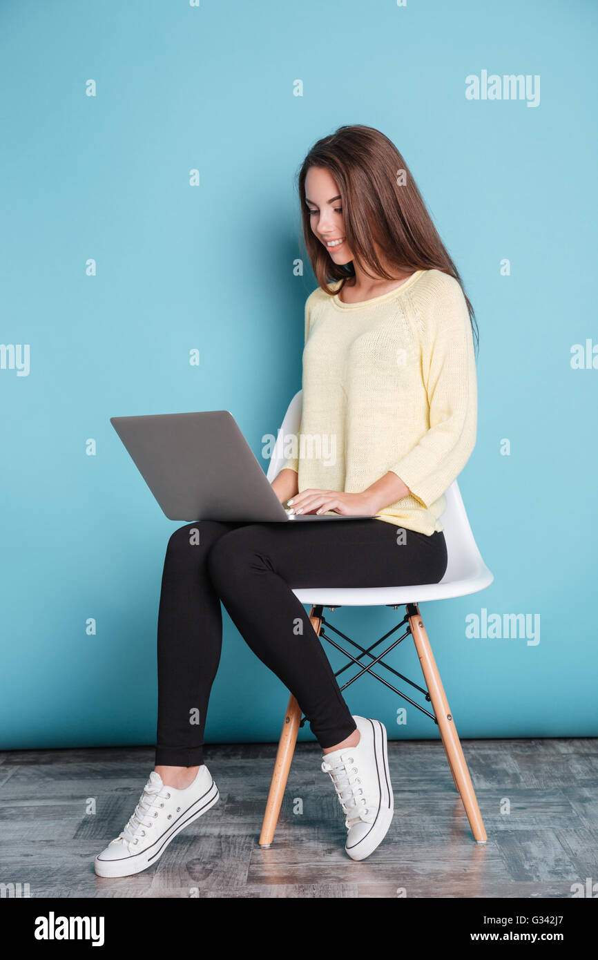 Young beautiful smart girl using laptop pc computer for study isolated ...