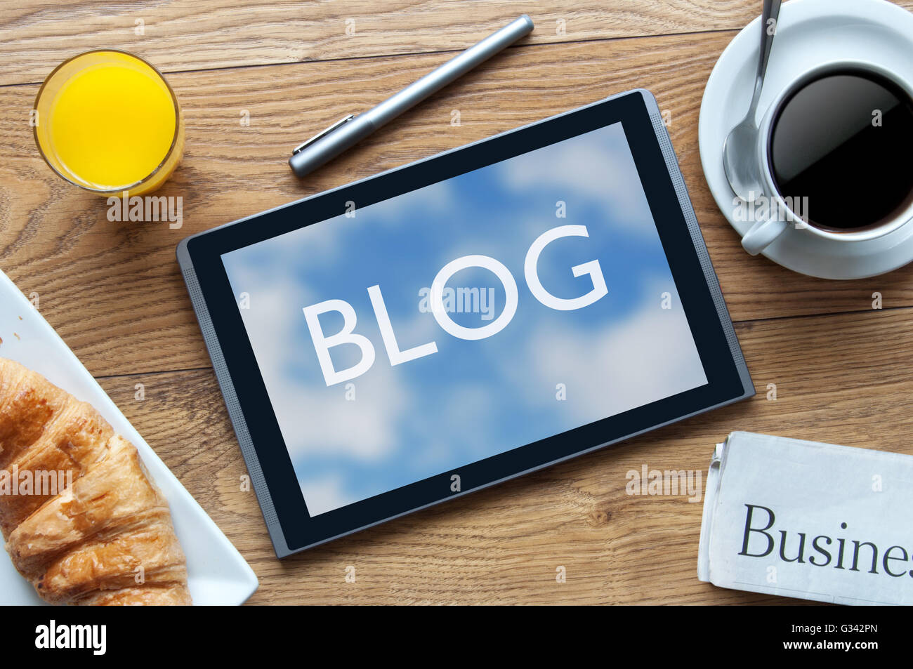 Computer tablet with blog cloud text on a work desk Stock Photo - Alamy