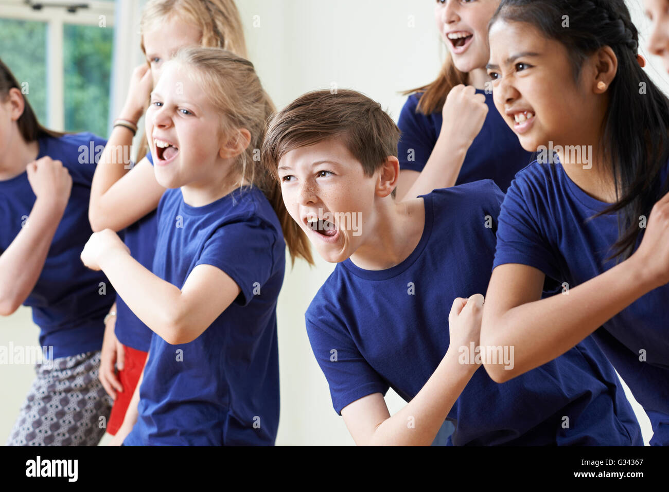 Group Of Children Enjoying Drama Class Together Stock Photo - Alamy