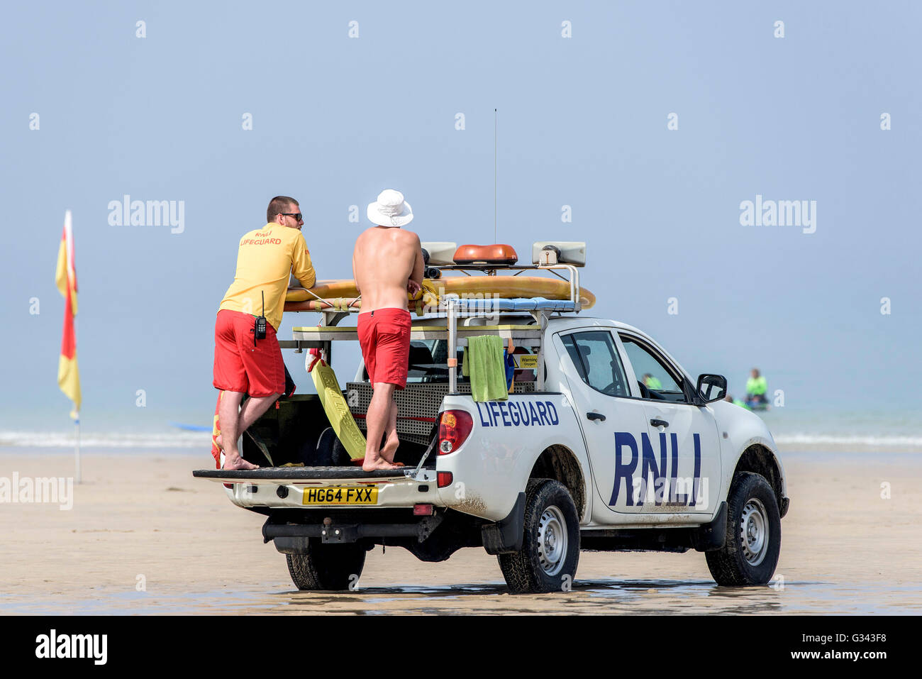 RNLI Lifeguards on duty at Fistral Beach in Newquay, Cornwall Stock ...