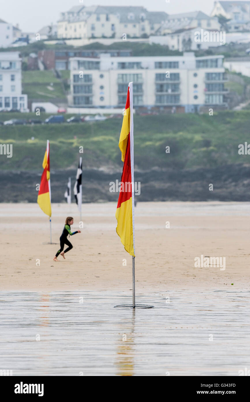 RNLI safety flags on Fistral Beach in Newquay, Cornwall Stock Photo - Alamy