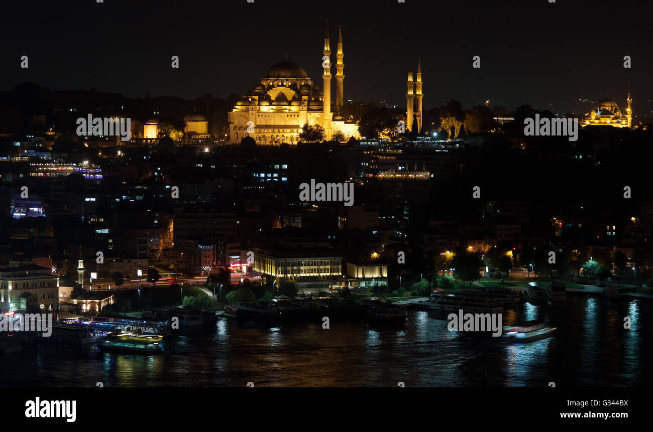Istanbul skyline from Galata bridge by night, with Suleymaniye mosque ...