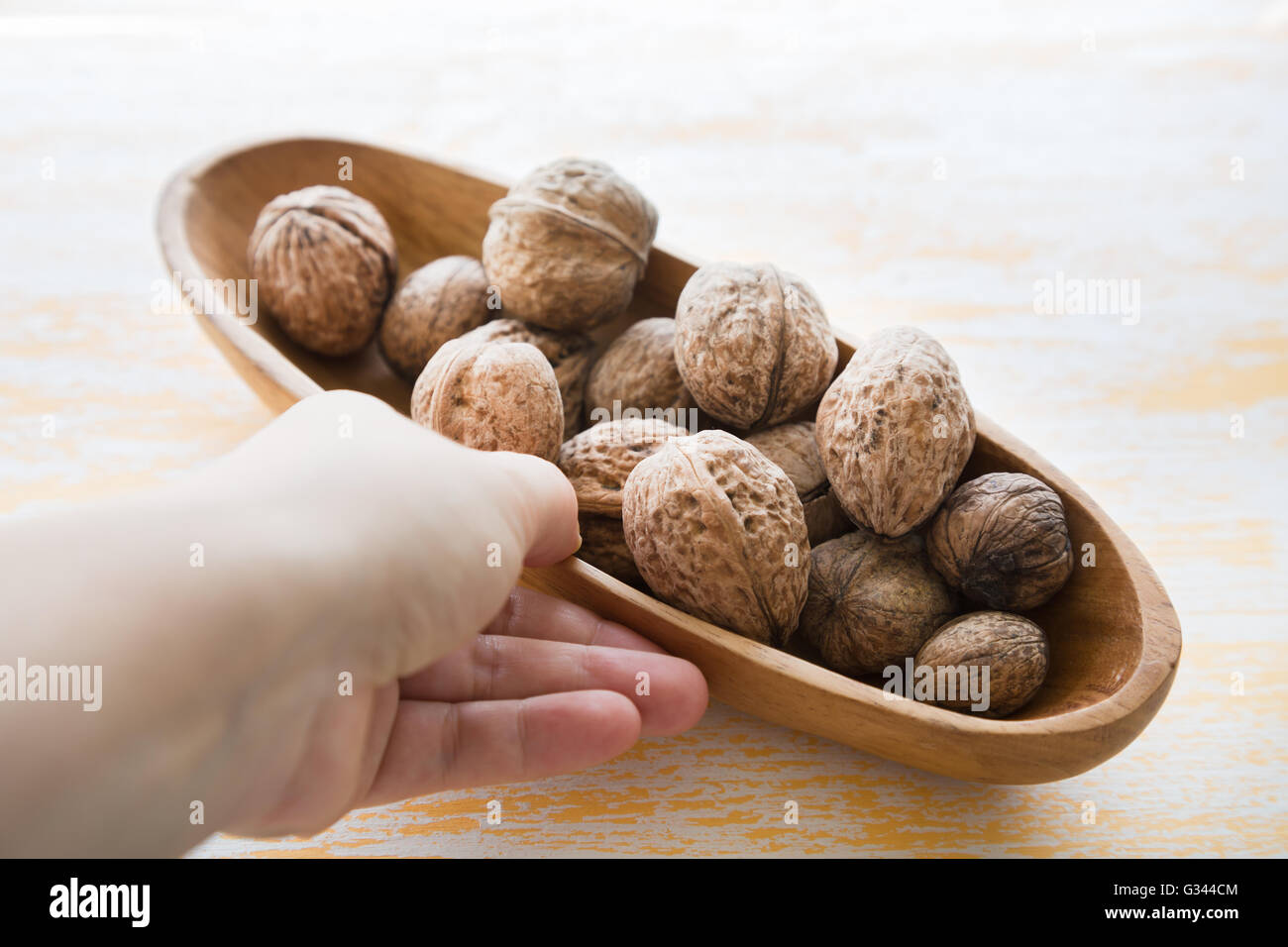 Walnuts in hand box hi-res stock photography and images - Alamy