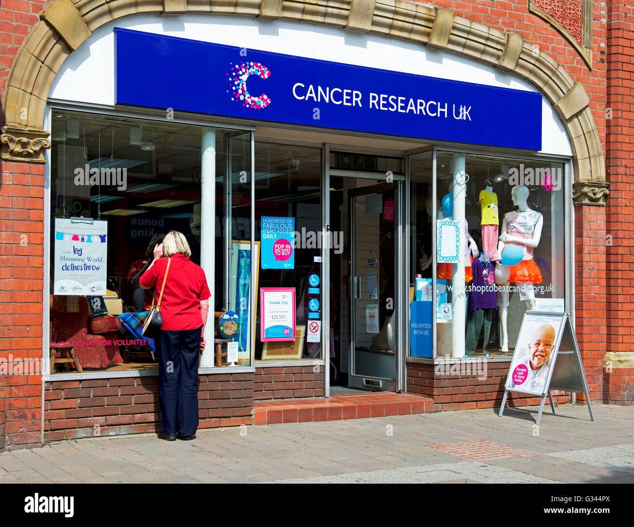 Cancer Research charity shop, England UK Stock Photo - Alamy