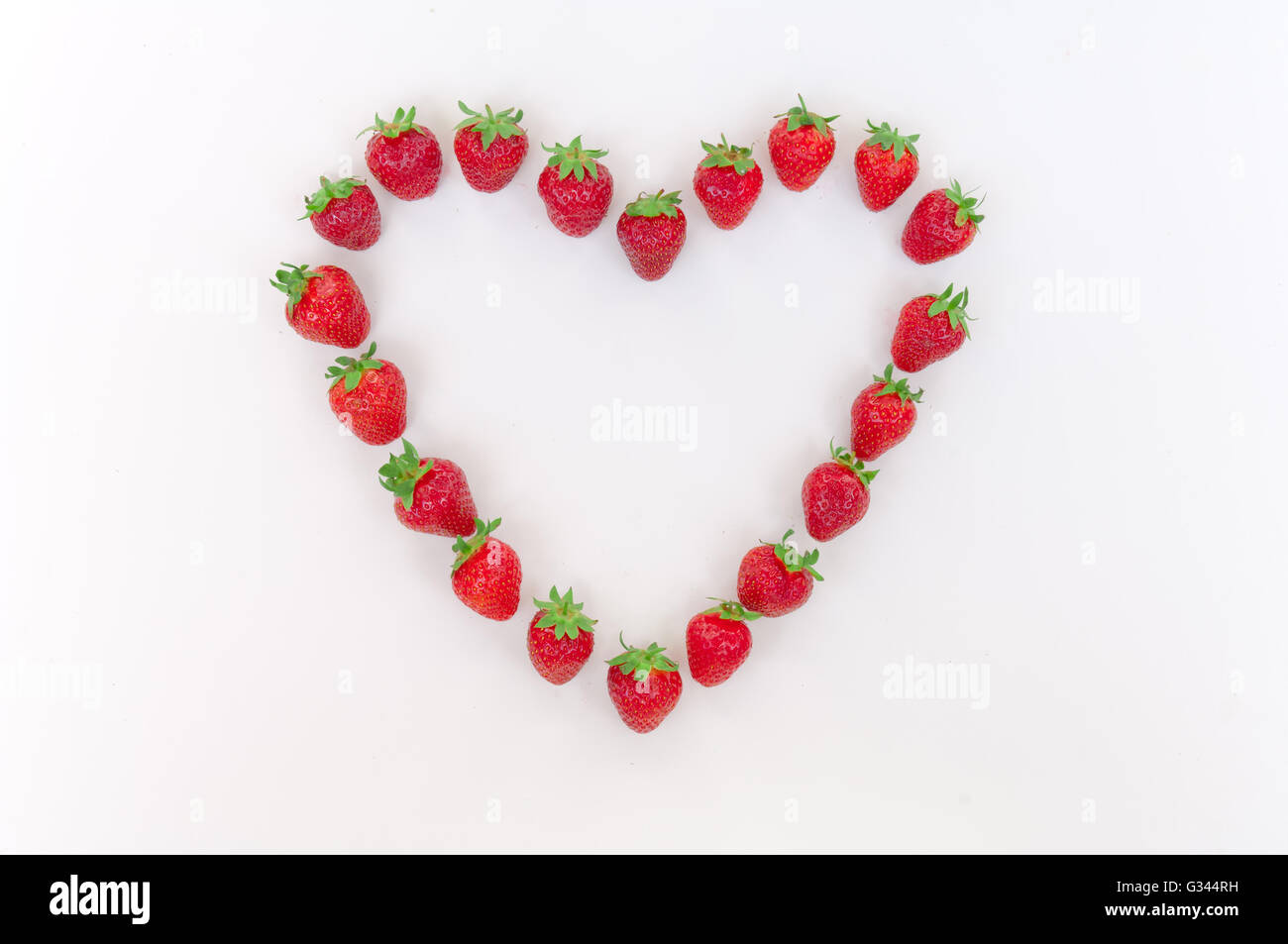 Heart shaped strawberries on white background, strawberry heart ...