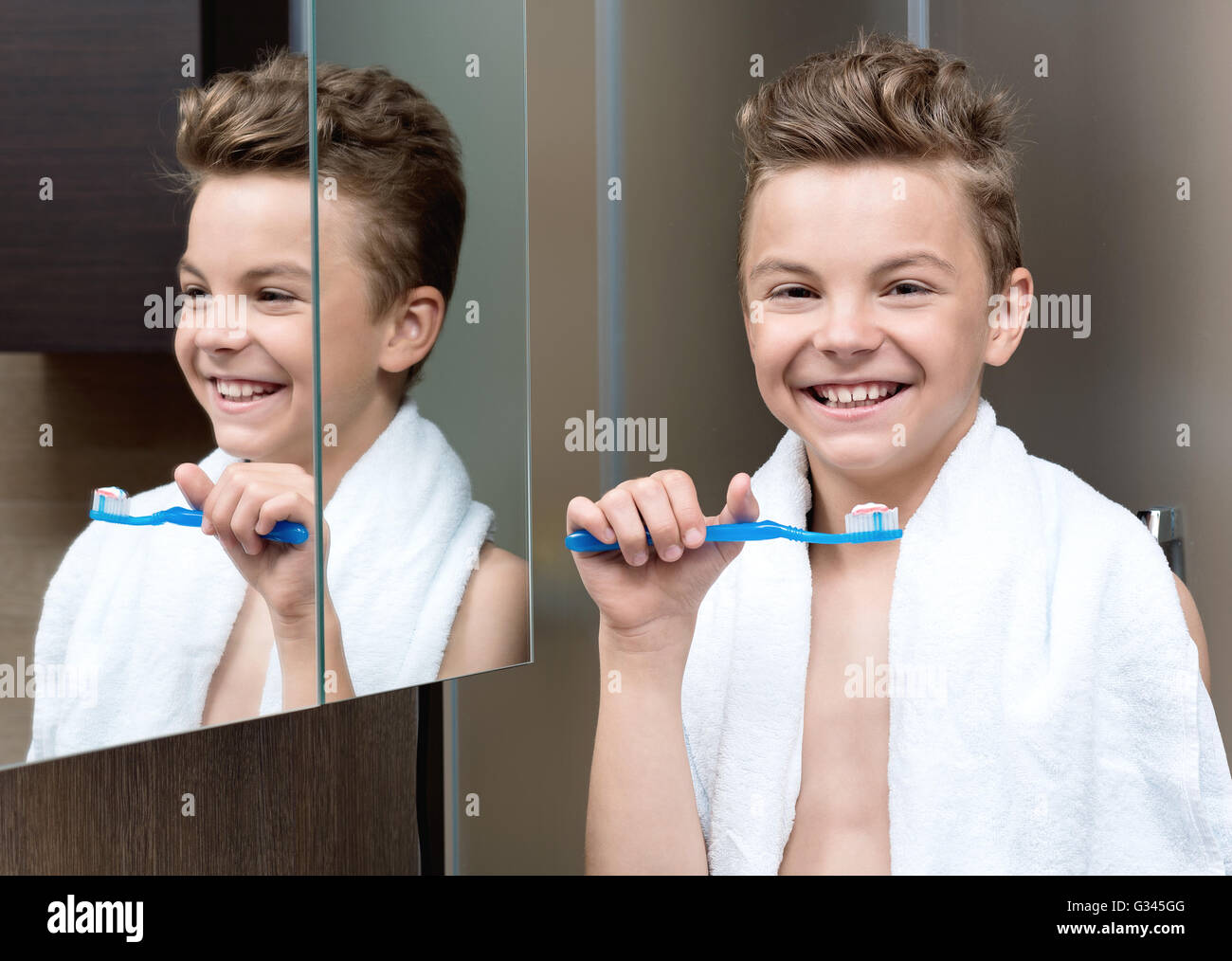 Smiling teen boy brushing teeth Stock Photo - Alamy