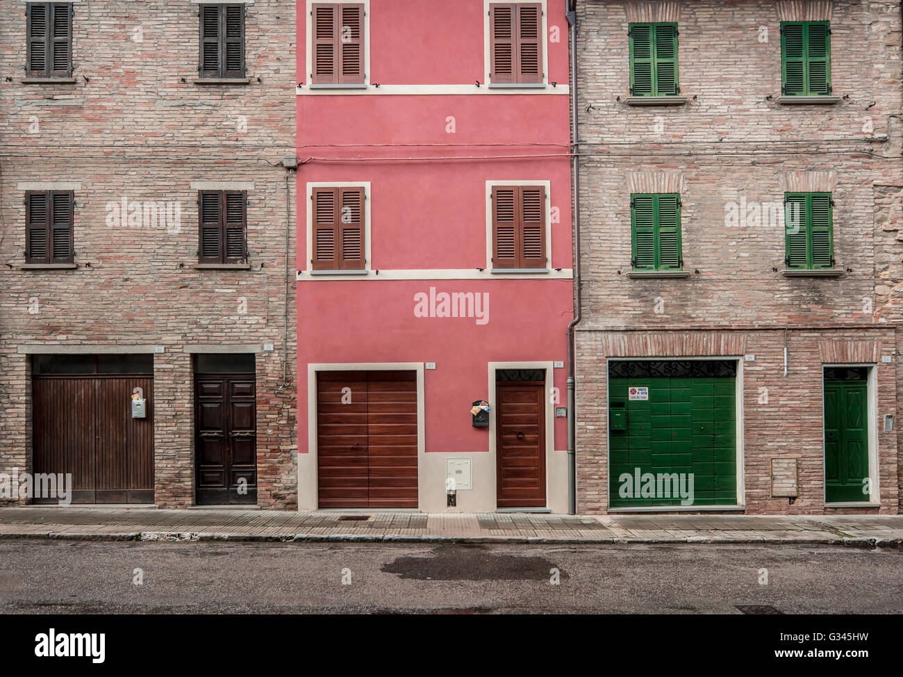 Facade of three three-story-high brick houses Stock Photo - Alamy