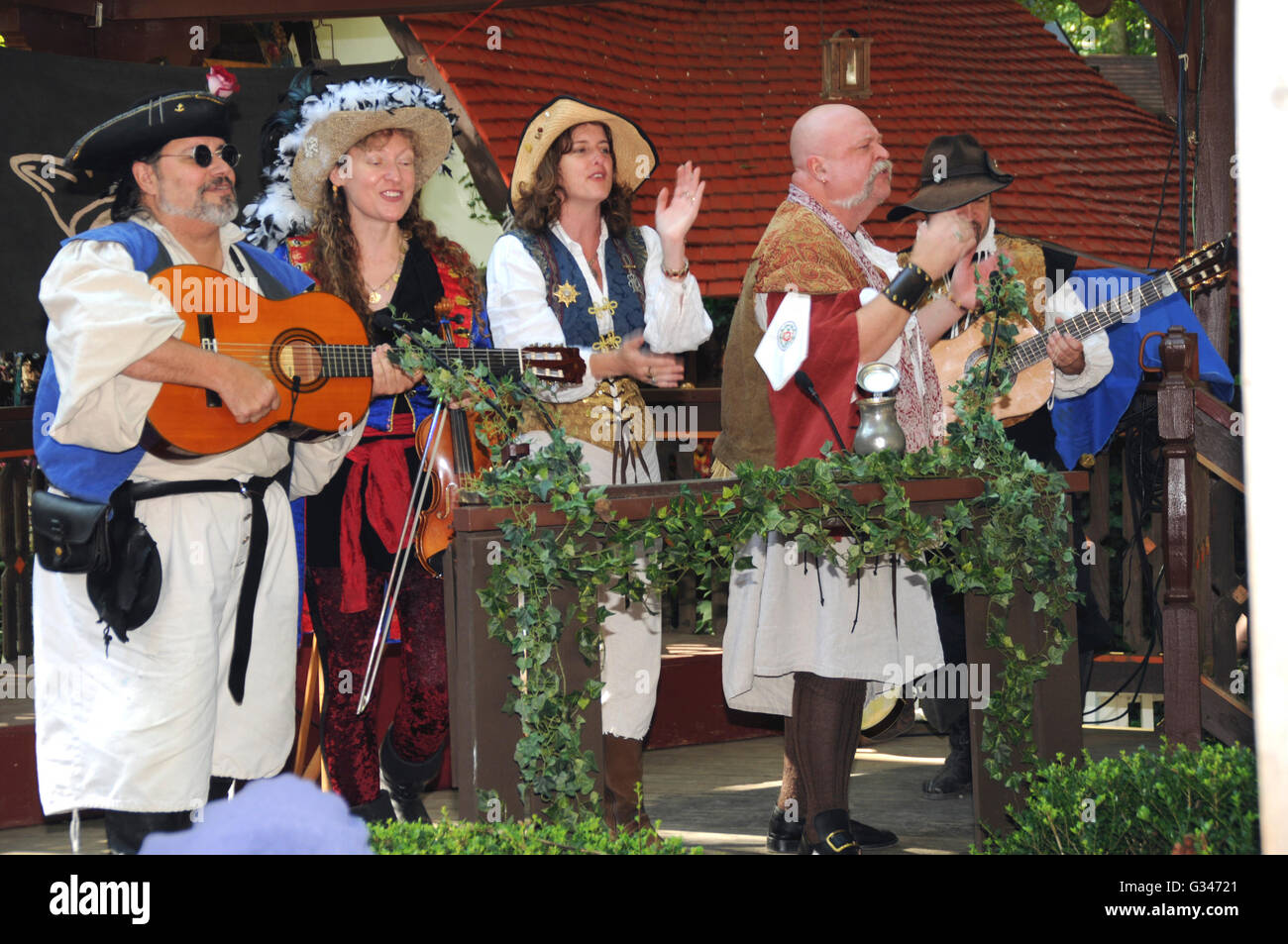 People dressed in medieval attire perform at the Renaissance Festival ...