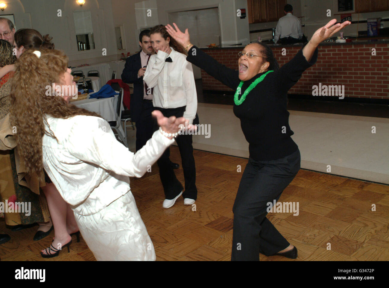 Two longtime friends meet each other at a dance in Bowie, Md Stock ...
