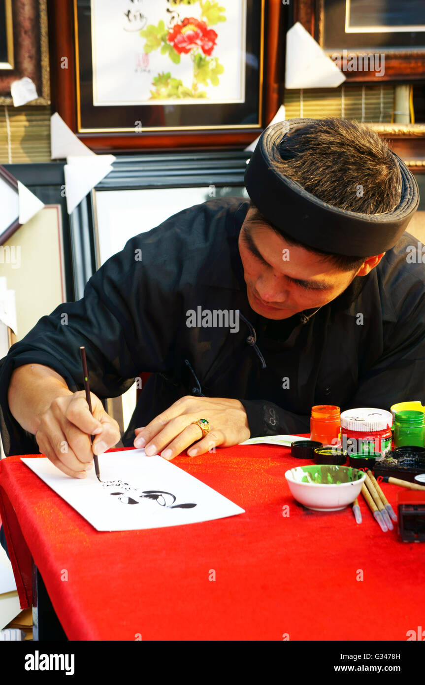 People writing calligraphy at fair, this is traditional culture of ...