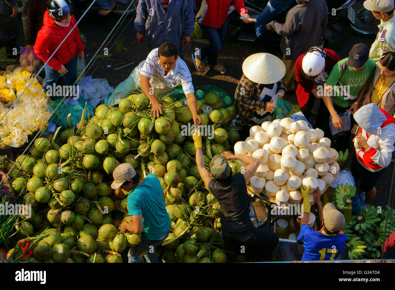 People sell and buy coconut at farmers market in Dalat, Vietnam Stock ...