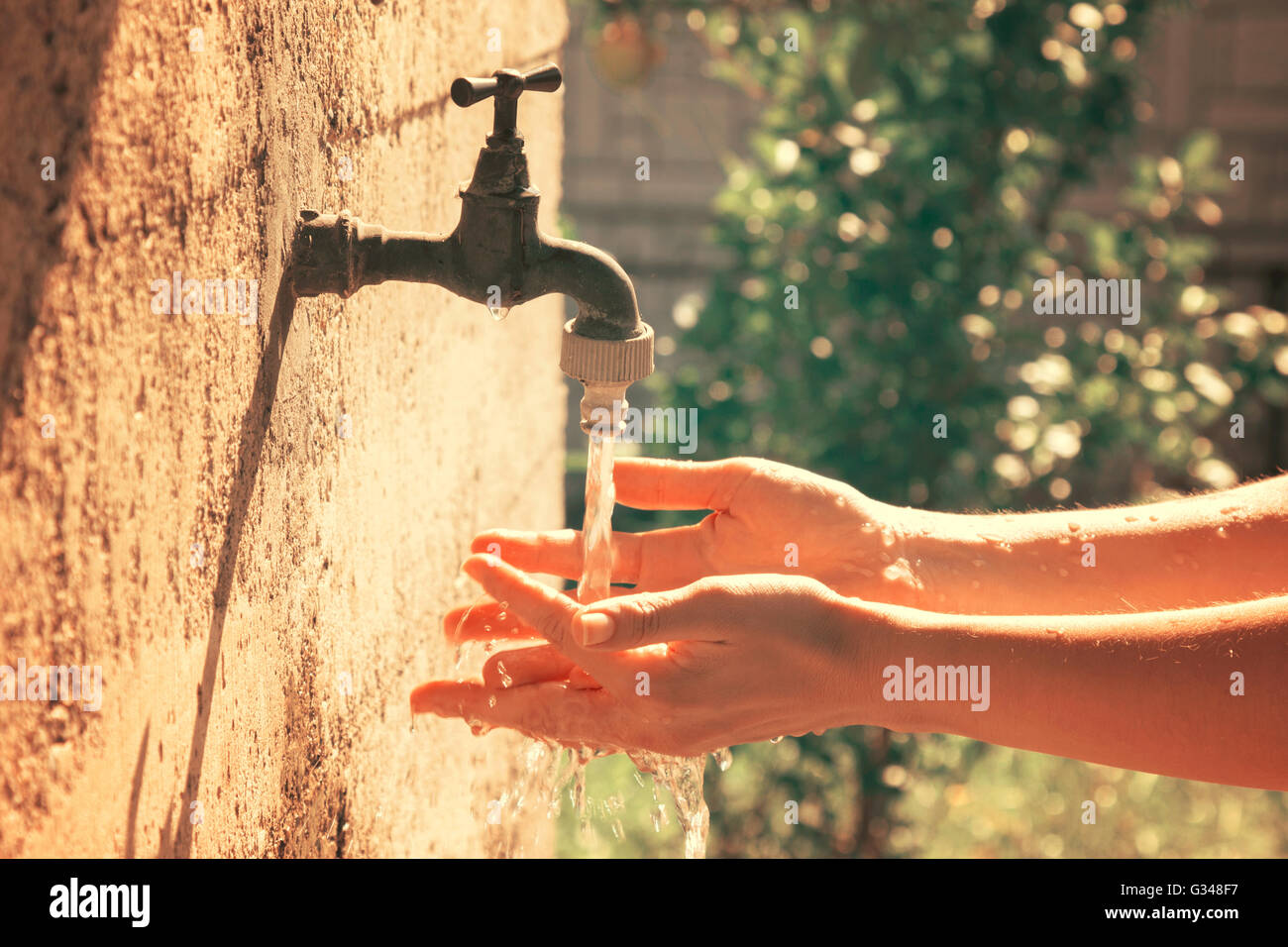 Washing hands outdoor tap woman hi-res stock photography and images - Alamy