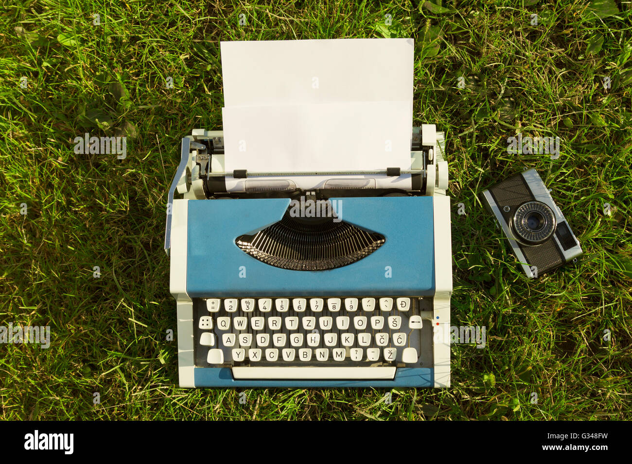 Blue retro typewriter paper sheet hi-res stock photography and images ...