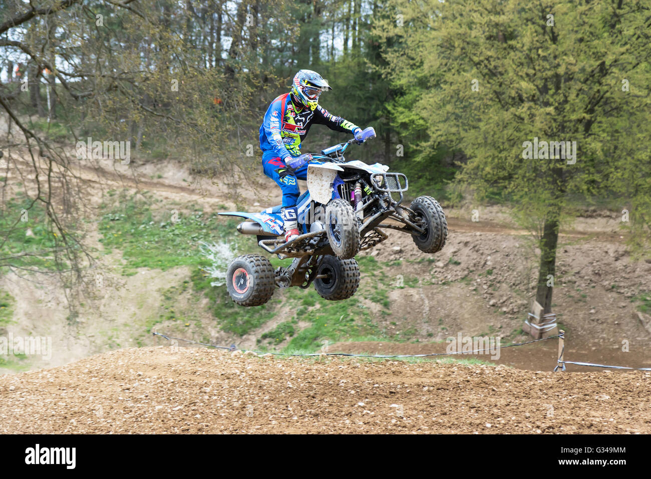 Quad rider is high jumping in the difficult terrain Stock Photo - Alamy