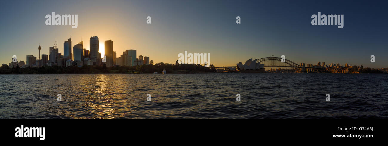 A panoramic photograph of Sydney Harbour in Australia at sunset. Sydney ...