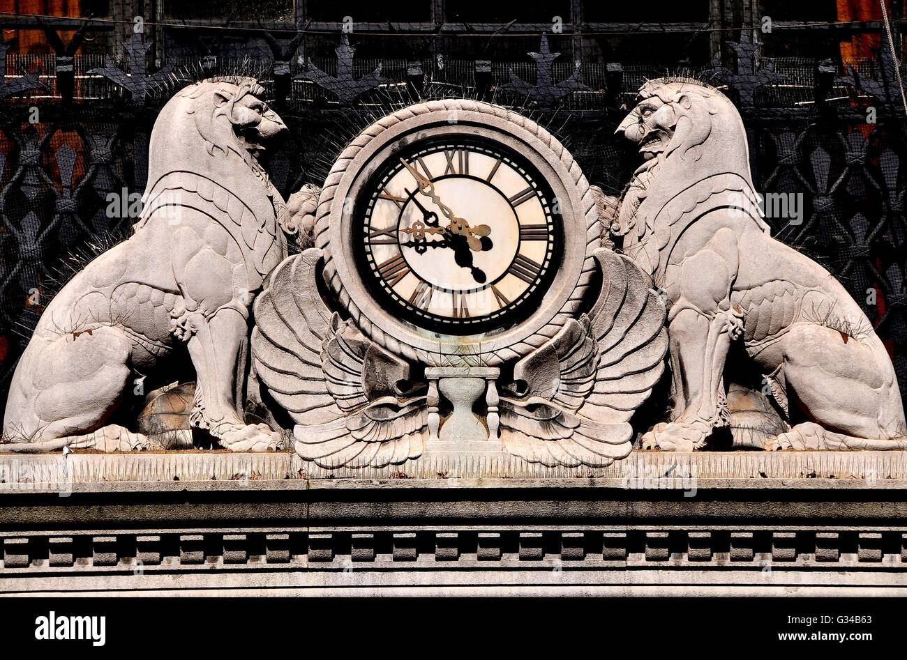 New York City: Art deco lions flank the clock on the south front of the ...
