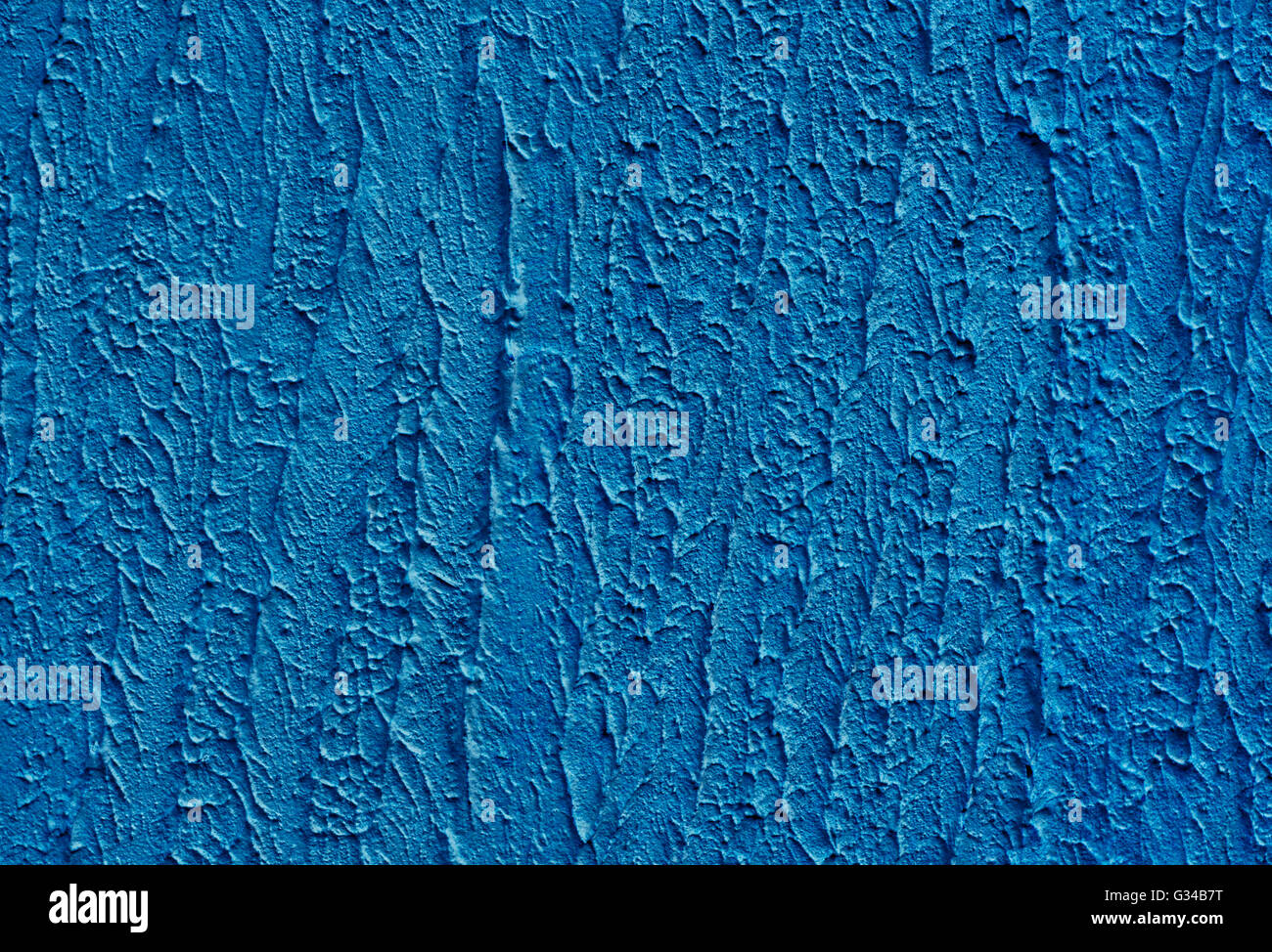 Detail of a blue bumpy cement wall Stock Photo - Alamy