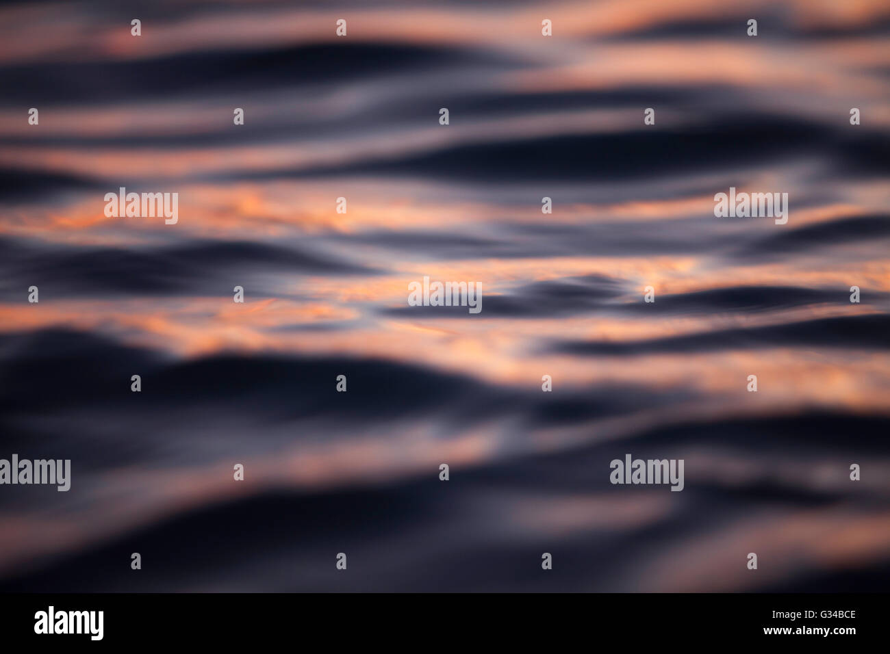 Closeup of ocean, waves, beach at sunset or dusk in Hawaii Stock Photo ...