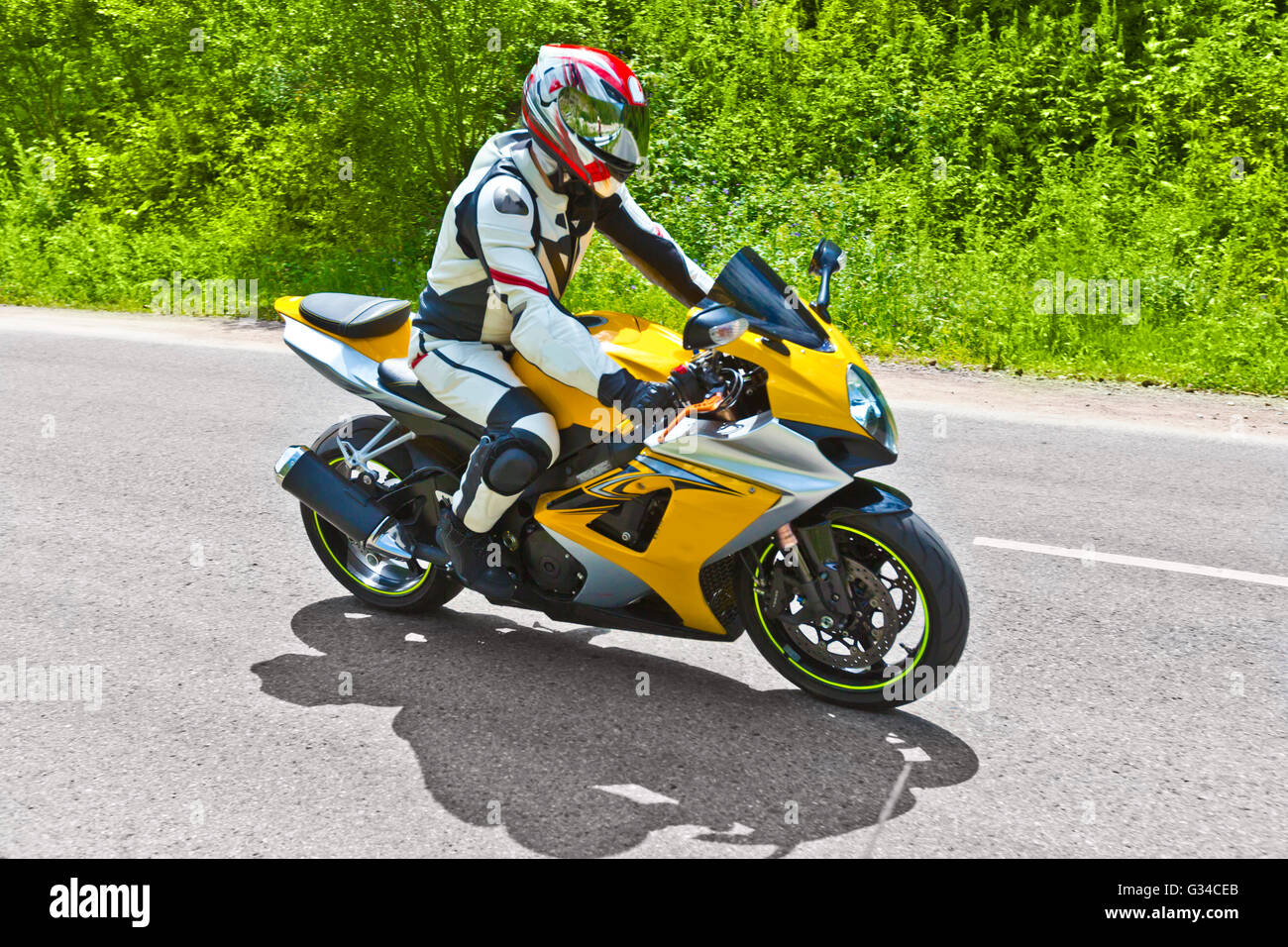 motorcyclist biker fast riding Stock Photo - Alamy