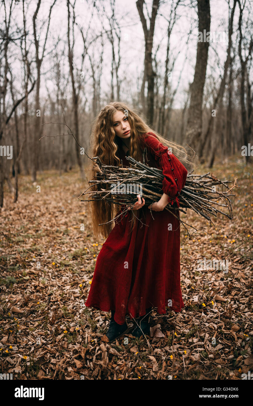 Young witch in the autumn forest Stock Photo - Alamy