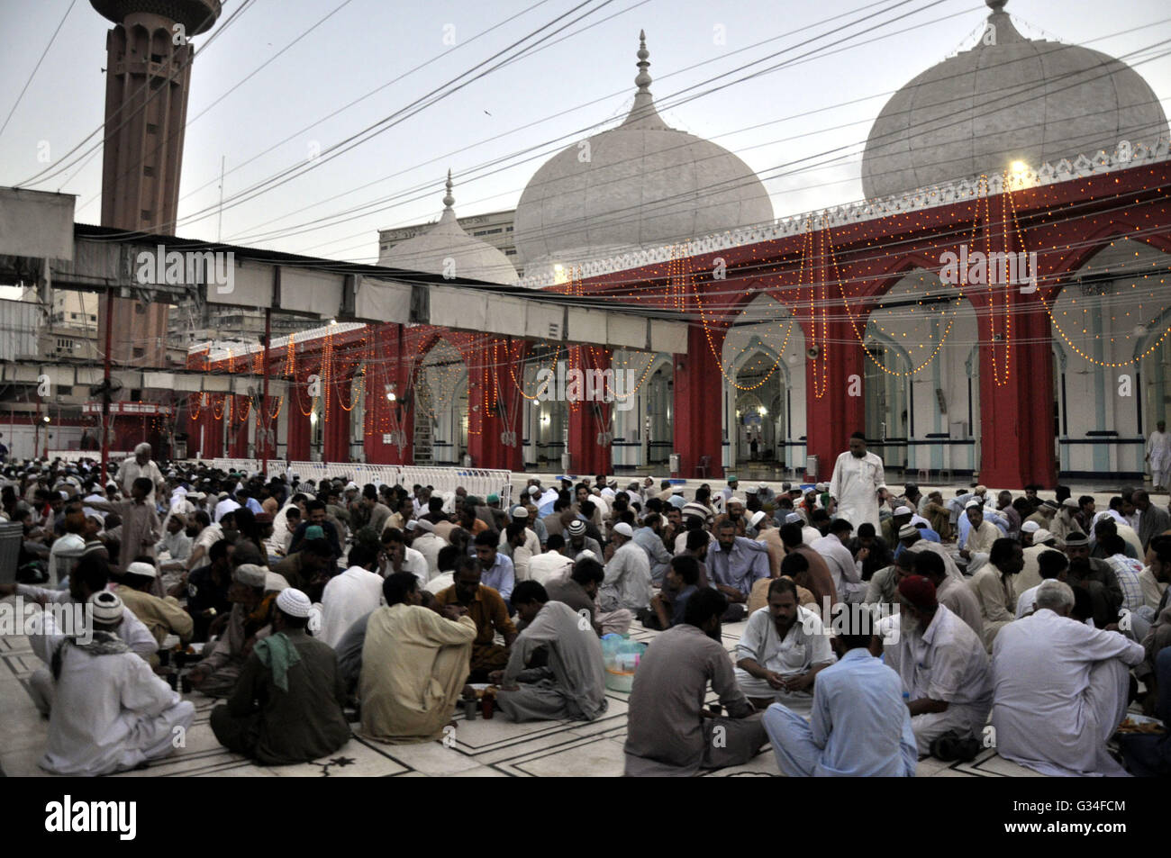 Karachi. 7th June, 2016. Pakistani Muslims break their fast at a mosque ...