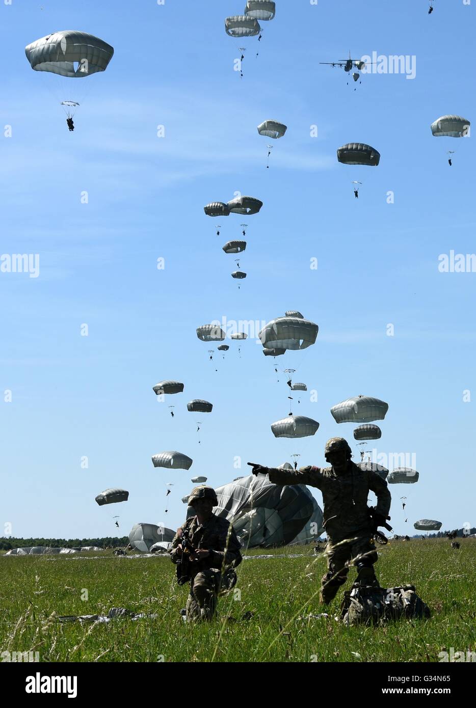 U.S. Army paratroopers of the 173rd Airborne Brigade parachute during a ...