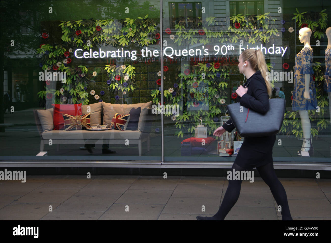 London, UK - 8 June 2016 - shoppers look at the John Lewis' window ...