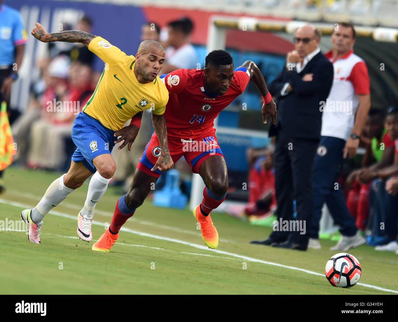 Orlando, USA. 8th June, 2016. Brazil's Dani Alves (L) fights with Haiti's James Marcelin during ...