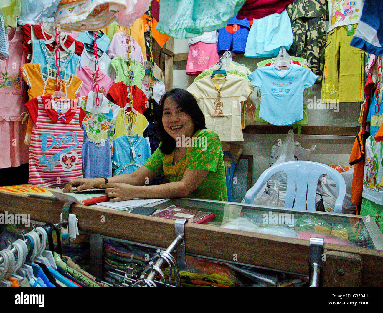 Asia Myanmar, Yangon, Hedlan Market, selling baby clothes Stock Photo - Alamy