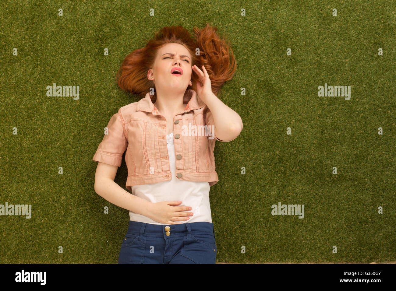 Beautiful woman on grass Stock Photo - Alamy