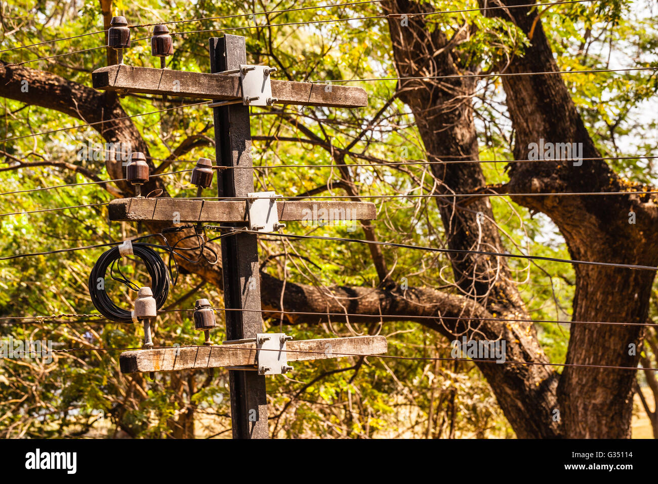 a small old telegraph pole with wires in the countryside Stock Photo ...