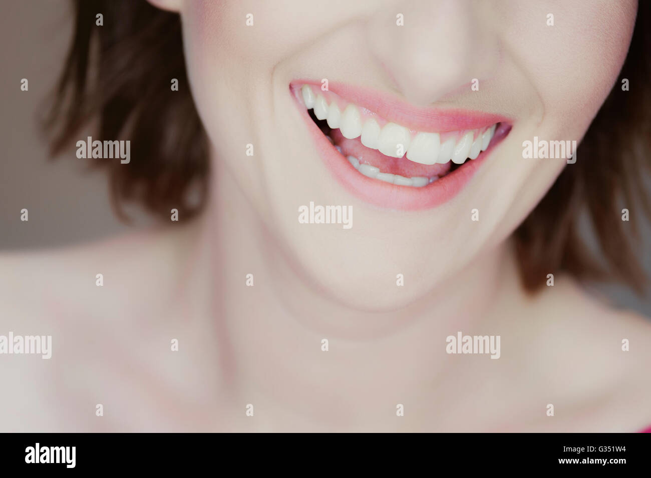 Mouth of a smiling young woman, detail Stock Photo - Alamy