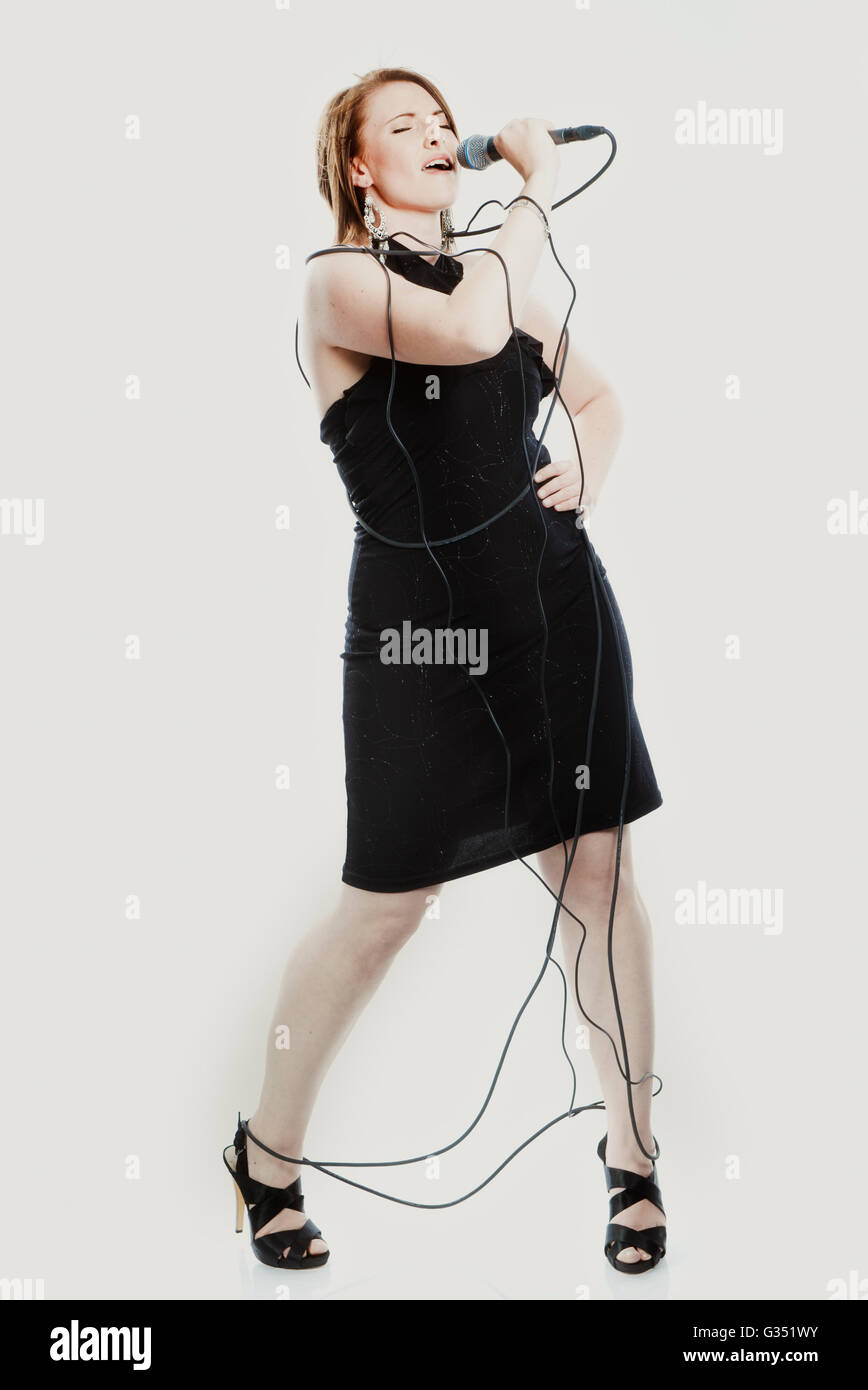 Female singer microphone full body hi-res stock photography and images ...
