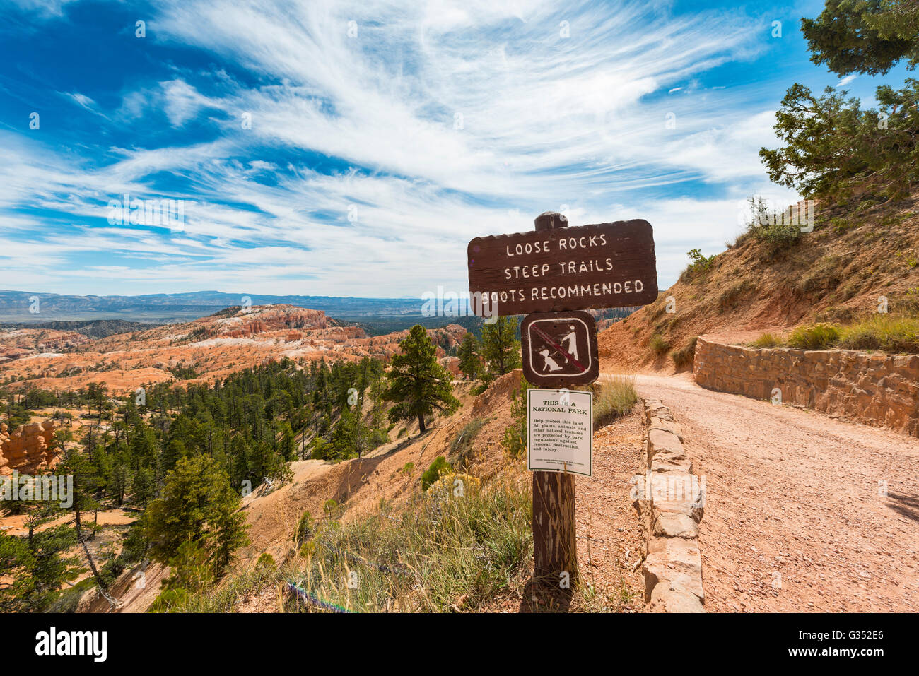 Hiking trail, warning sign, reddish rock formations, sandstone ...