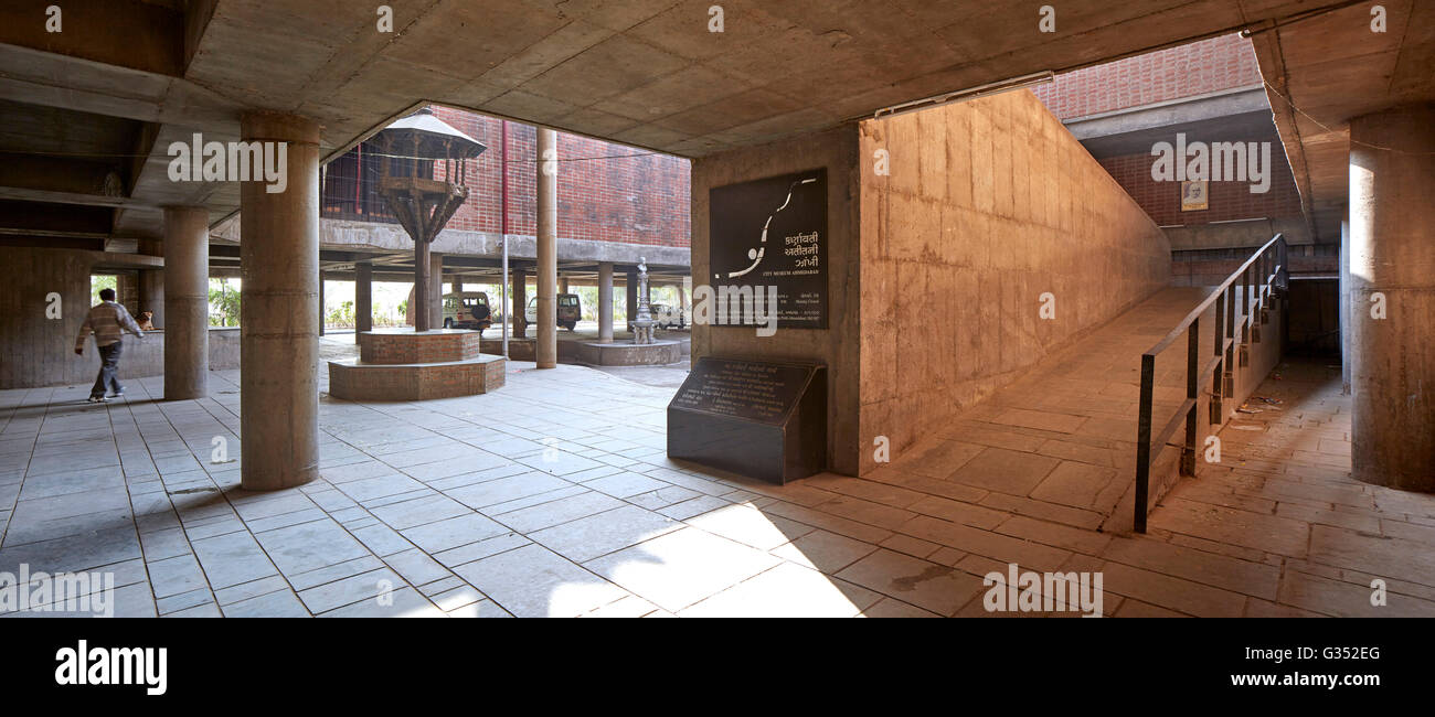 Views around undercroft towards entrance ramp. Sanskar Kendra ...