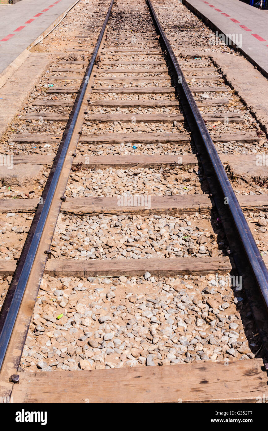 a country rail road track in a small thai village near kanchanaburi ...