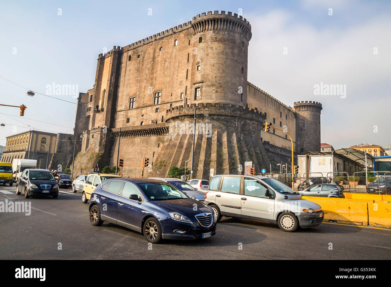 Street traffic in Naples,Italy. Castle Nuovo building Stock Photo - Alamy