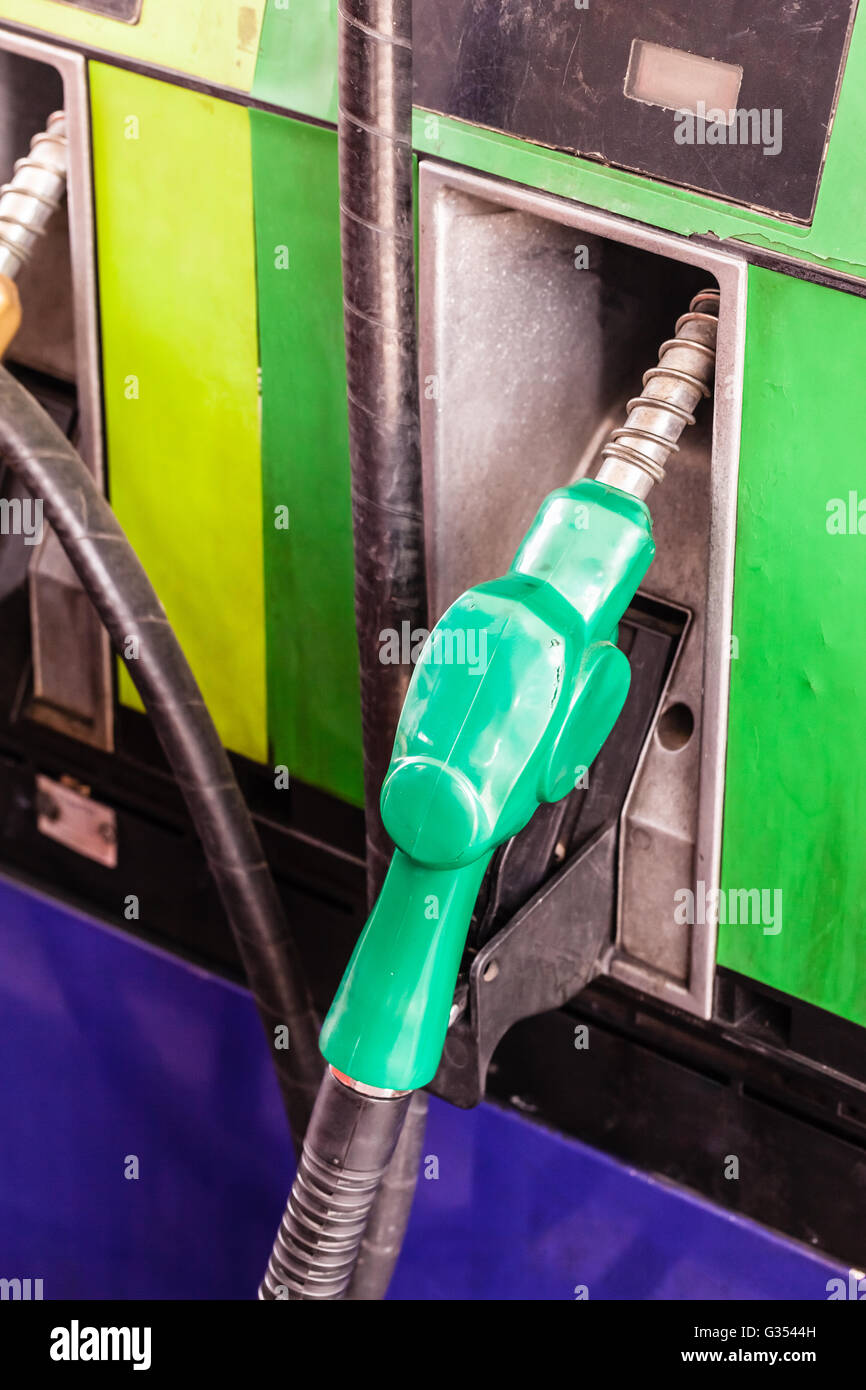 colored petrol gas pump nozzles in a service station Stock Photo - Alamy