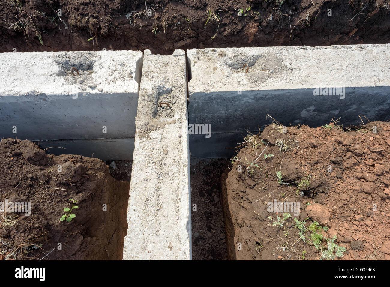 Grey construction concrete building blocks used for the foundations of a self-built house ...