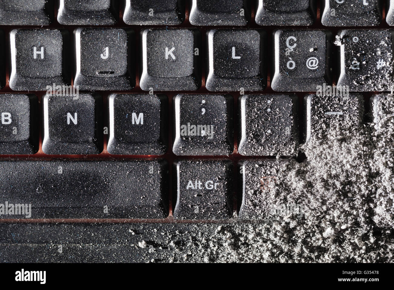 a dirty black keyboard covered in ash or dust Stock Photo - Alamy