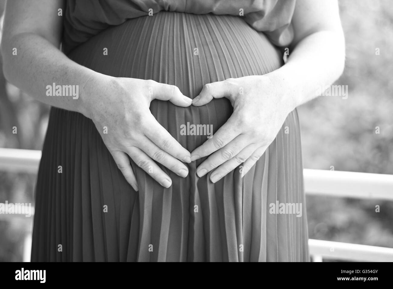 Pregnant woman expecting child Stock Photo - Alamy